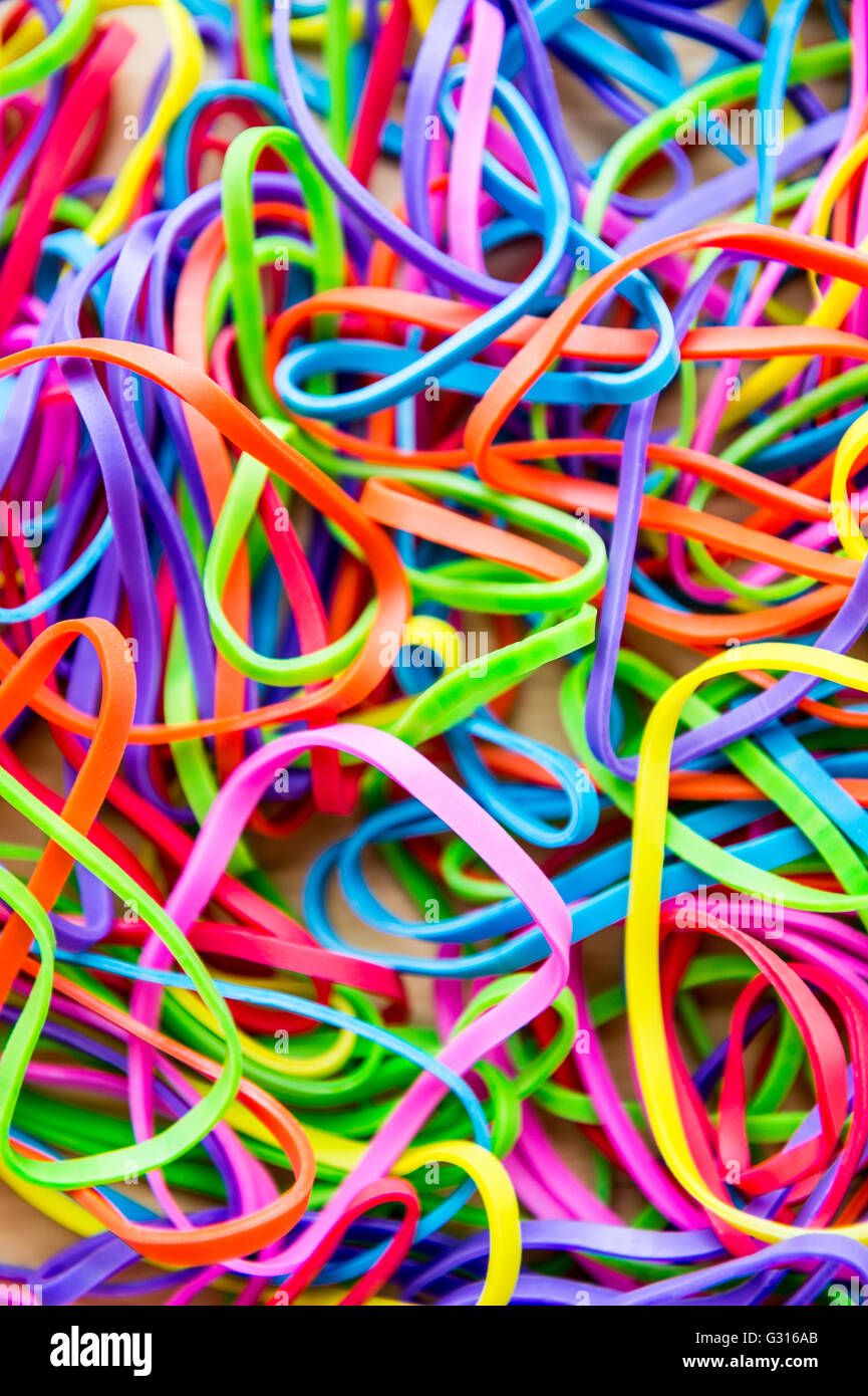 Bright abstract colorful background of jumble of rainbow rubber bands ...