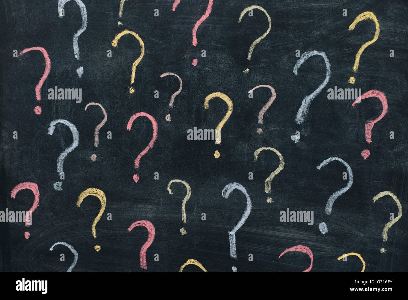 Colorful question marks on chalkboard background. Close up Stock Photo ...