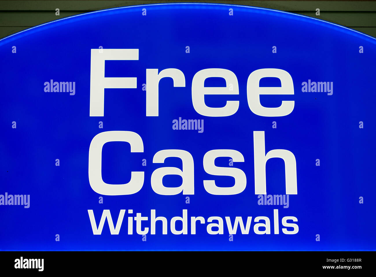 Bright blue sign, above an ATM / Cashpoint machine reading "Free Cash ...