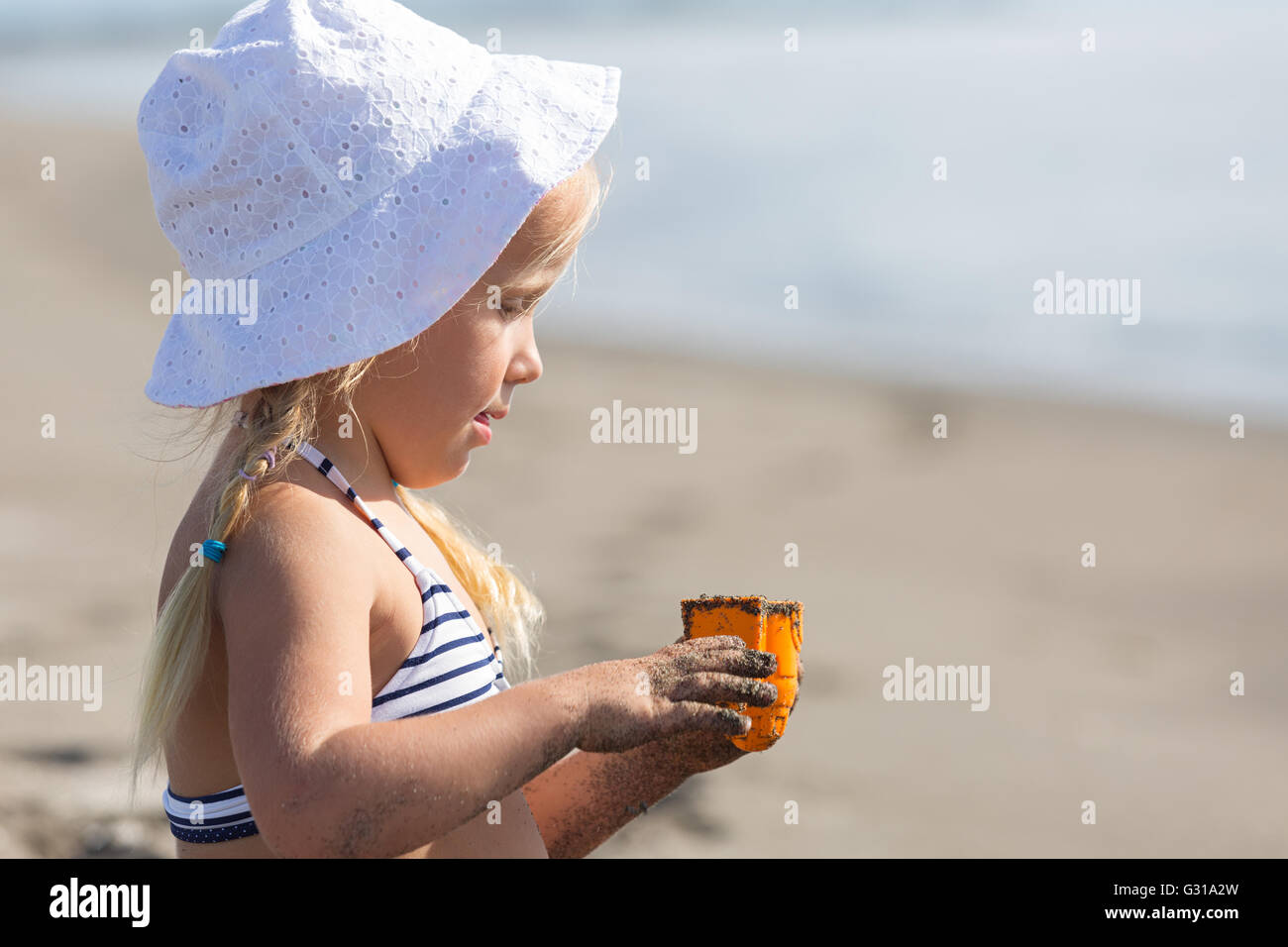 Sandcastle building family hi-res stock photography and images - Alamy