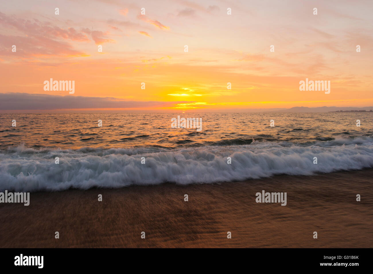 Ocean sunset is a brightly lit golden seascape with a gentle wave ...