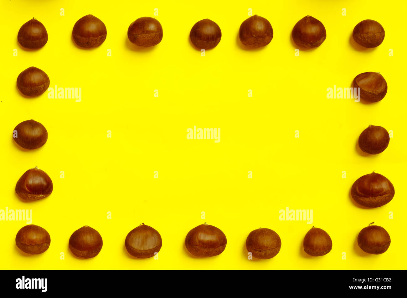Chestnut pattern on yellow background, top view, horizontal, copy space ...
