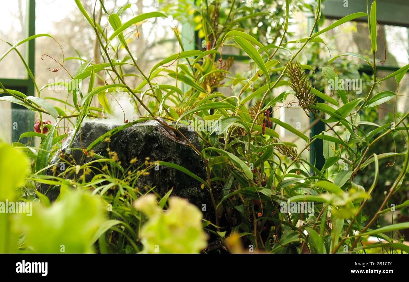 Artificial volcano with some smoke coming out Stock Photo - Alamy