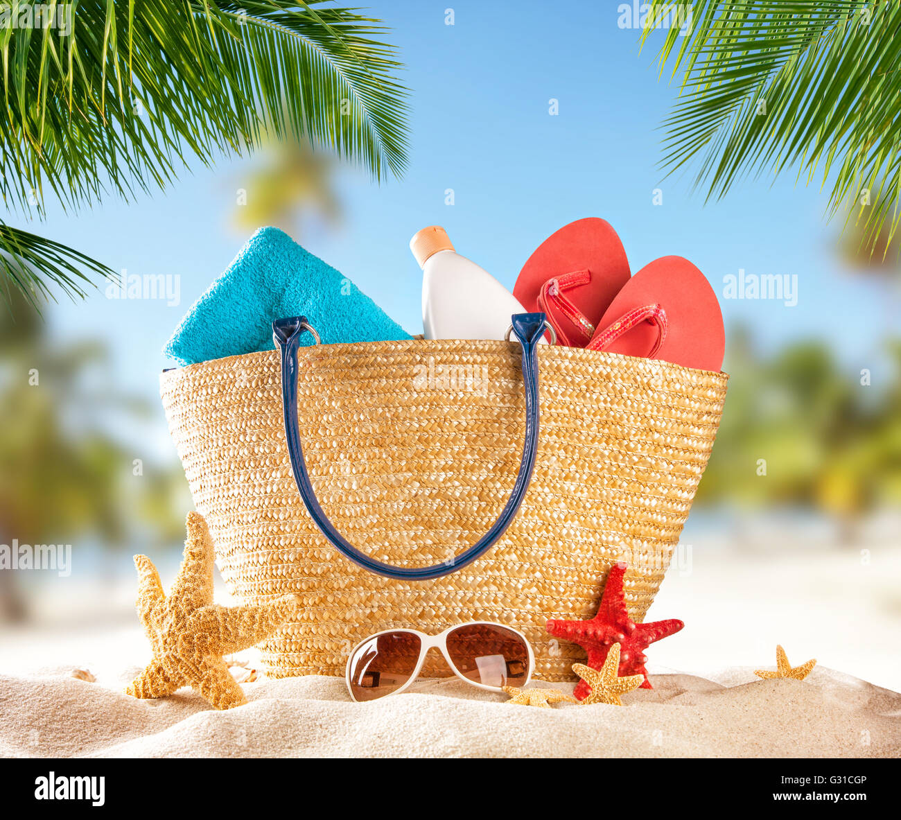 Summer concept of beach relaxation with accessories for sunbathing ...