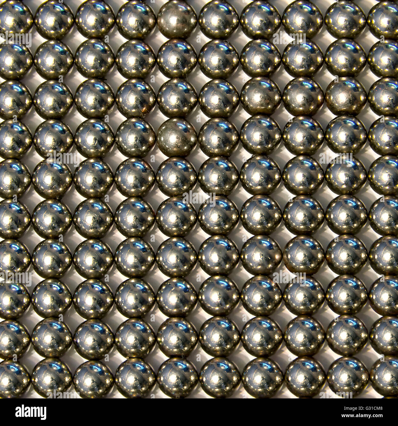 background of small metal balls on a light background Stock Photo - Alamy