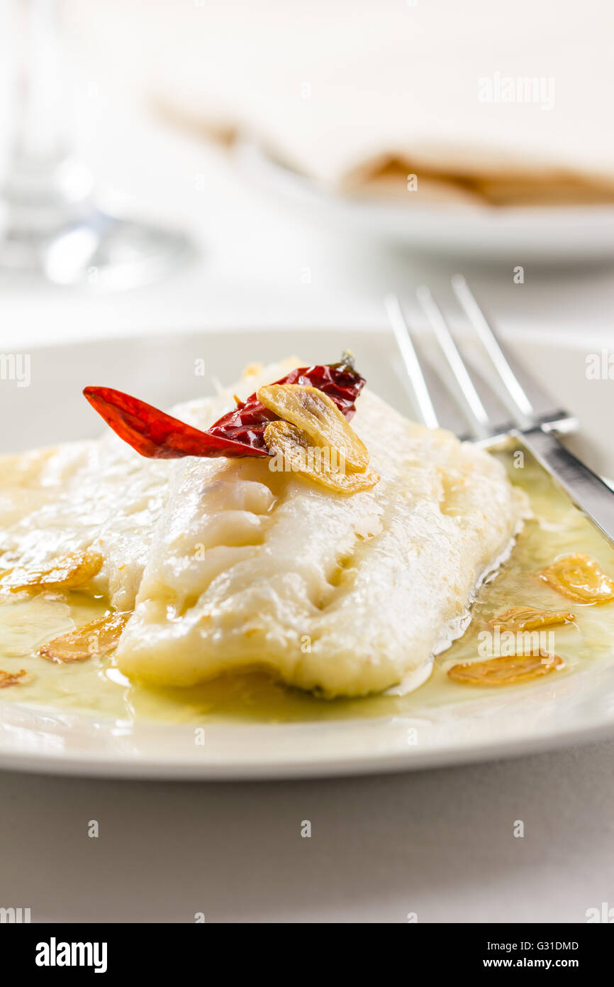 Basque style cod dish with chili pepper, garlic and olive oil Stock ...