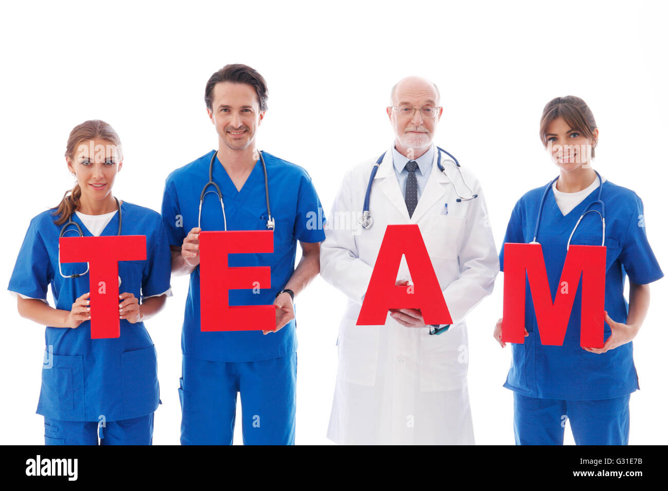 Doctors holding team letters isolated on white background Stock Photo ...