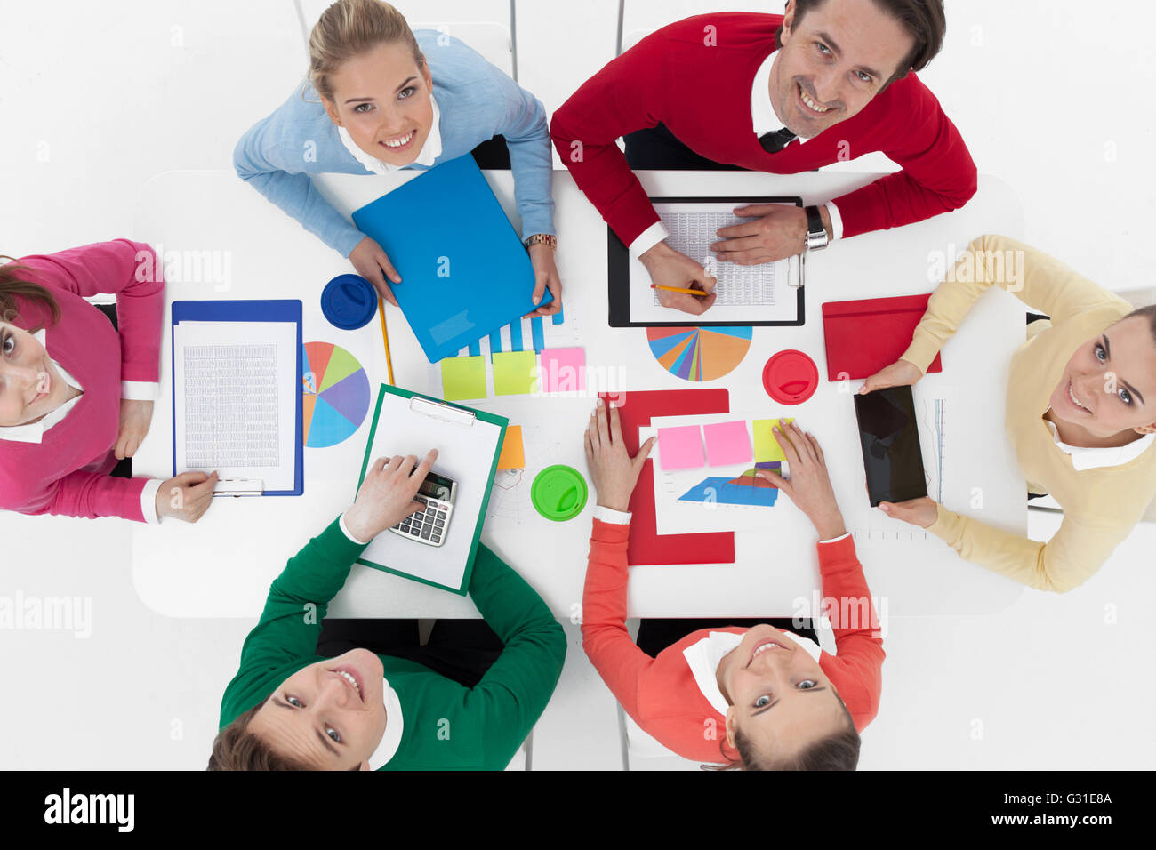 Business people working with reports sitting around the table Stock ...