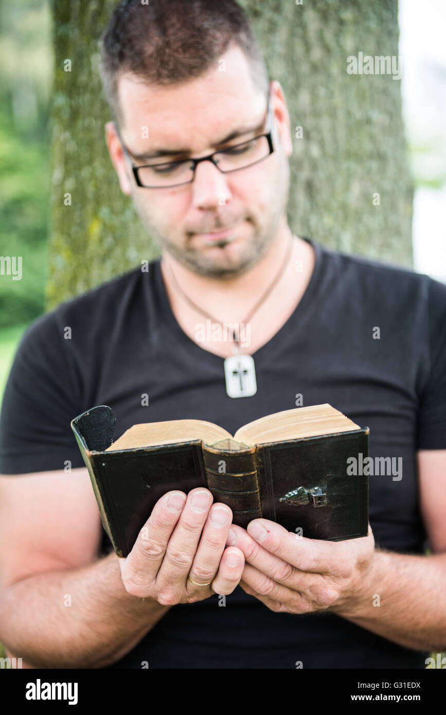 Man reading bible outside church hi-res stock photography and images ...