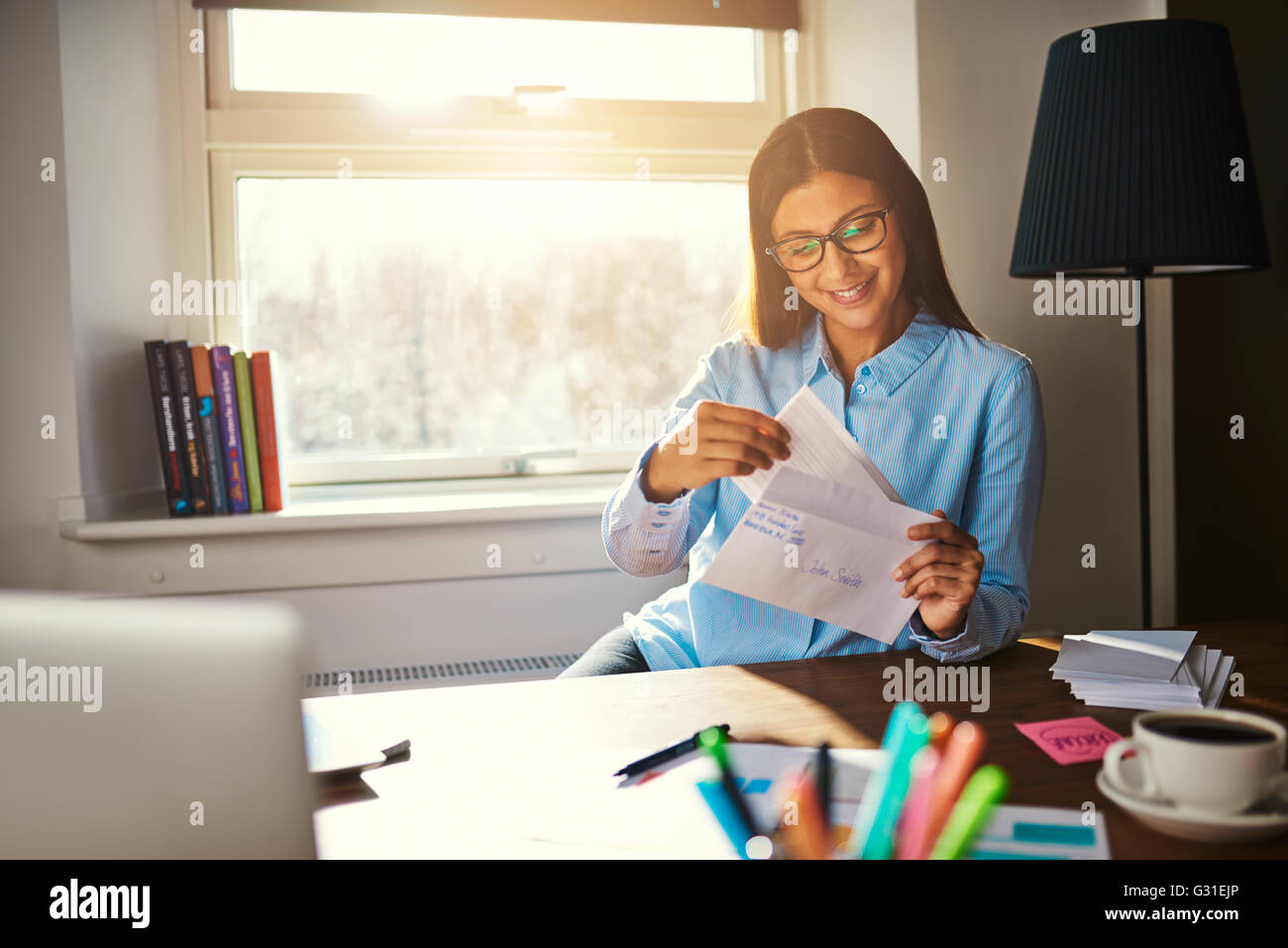 Business woman getting ready to mail a letter looking satisfied Stock ...