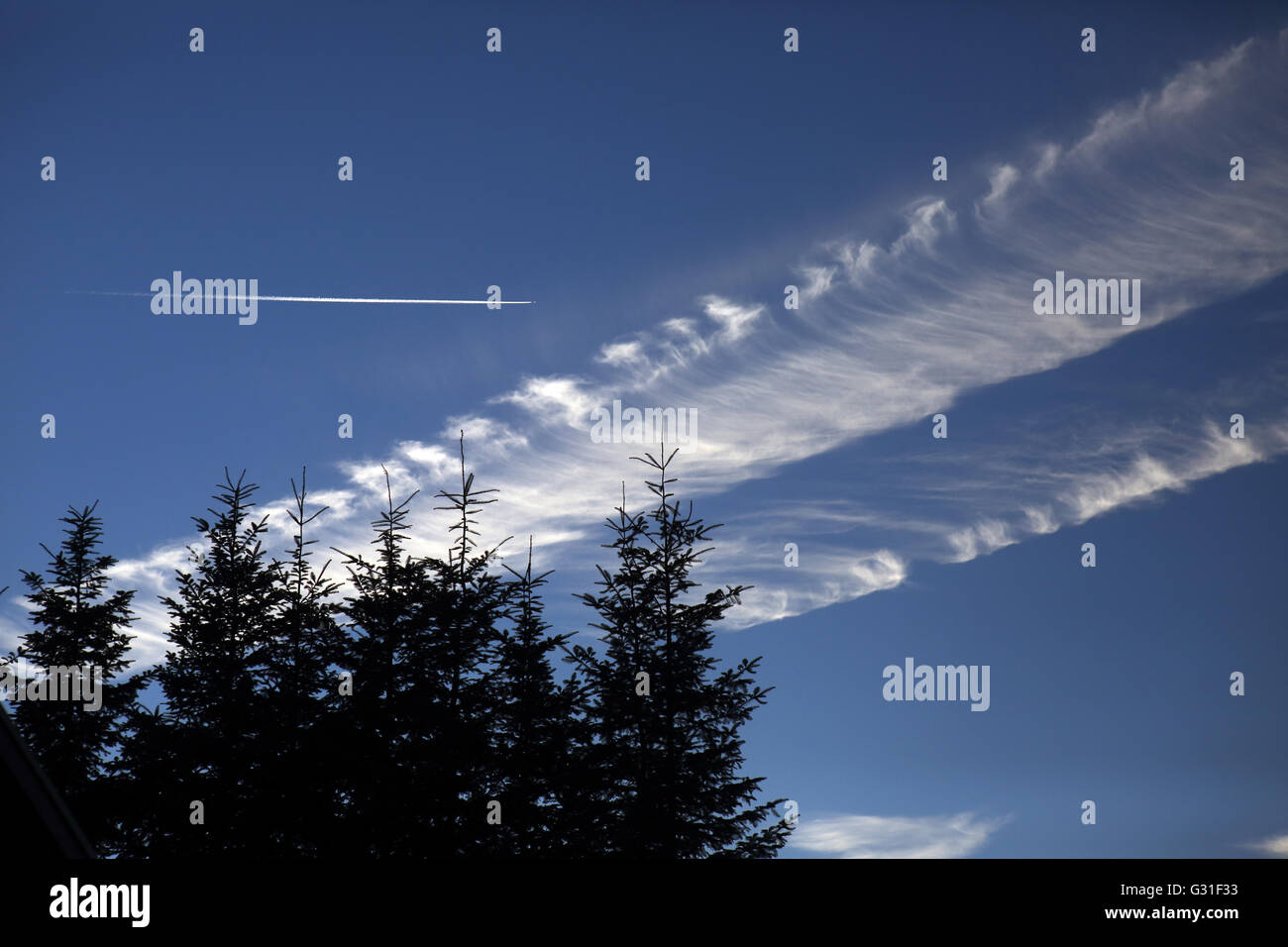 Briescht, Germany, contrails of airplanes in the sky Stock Photo - Alamy