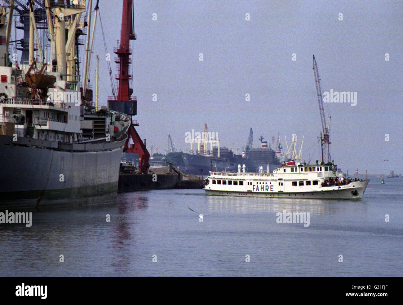 Rostock, DDR, cargo ships and ferry in Ueberseehafen Rostock Stock ...