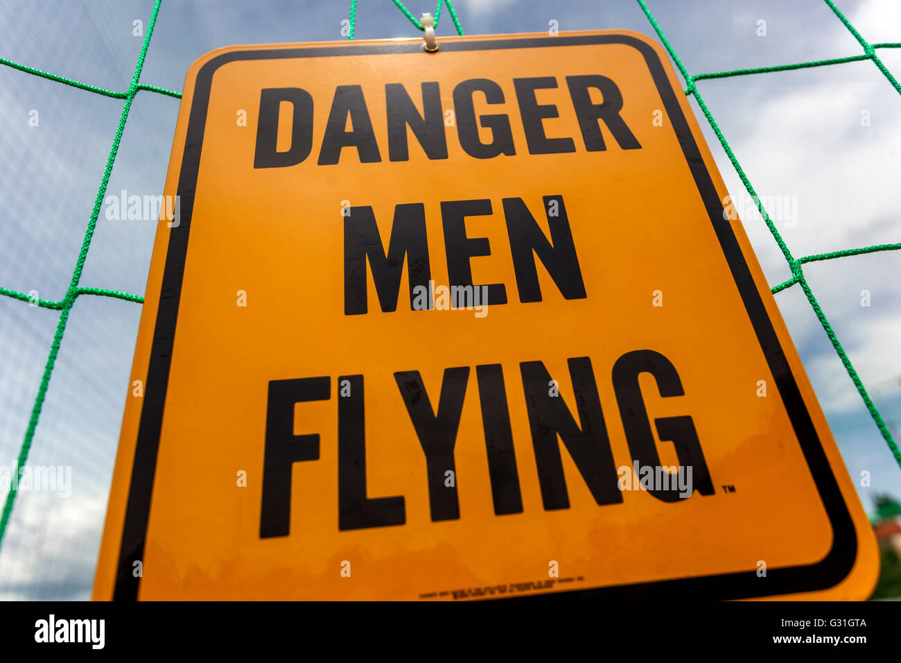 Danger men flying, sign Stock Photo - Alamy