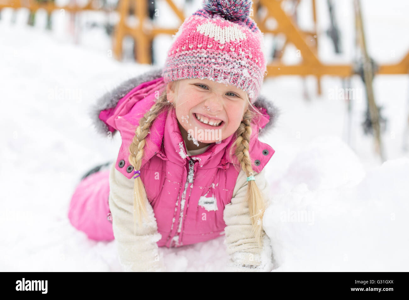 little girl happily playing in the snow Stock Photo - Alamy
