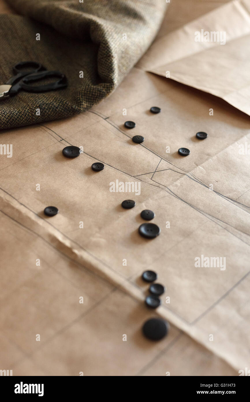 Atelier or Design Studio on tailoring. Patterns, spilling buttons and ...