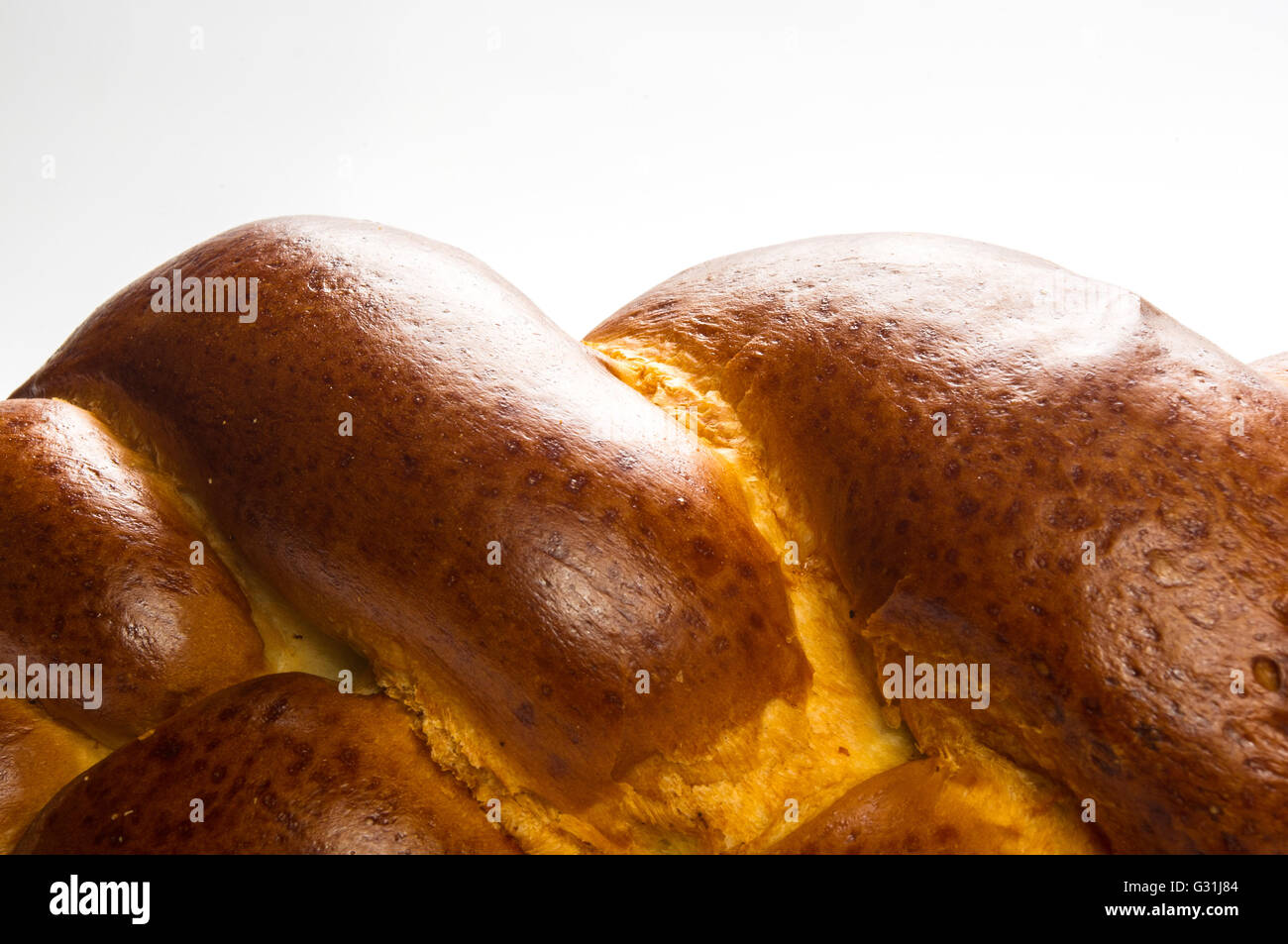 chunks large braided loaf on white background Stock Photo - Alamy