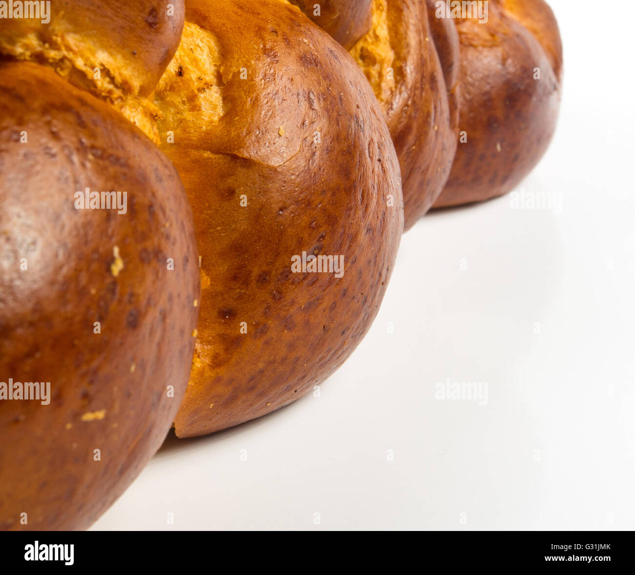 chunks large braided loaf on white background Stock Photo - Alamy