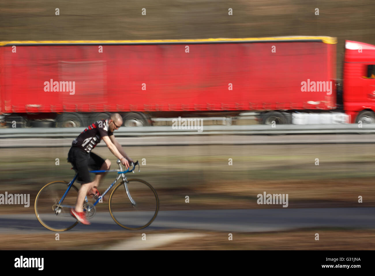 Car, cyclist and lorry hi-res stock photography and images - Alamy