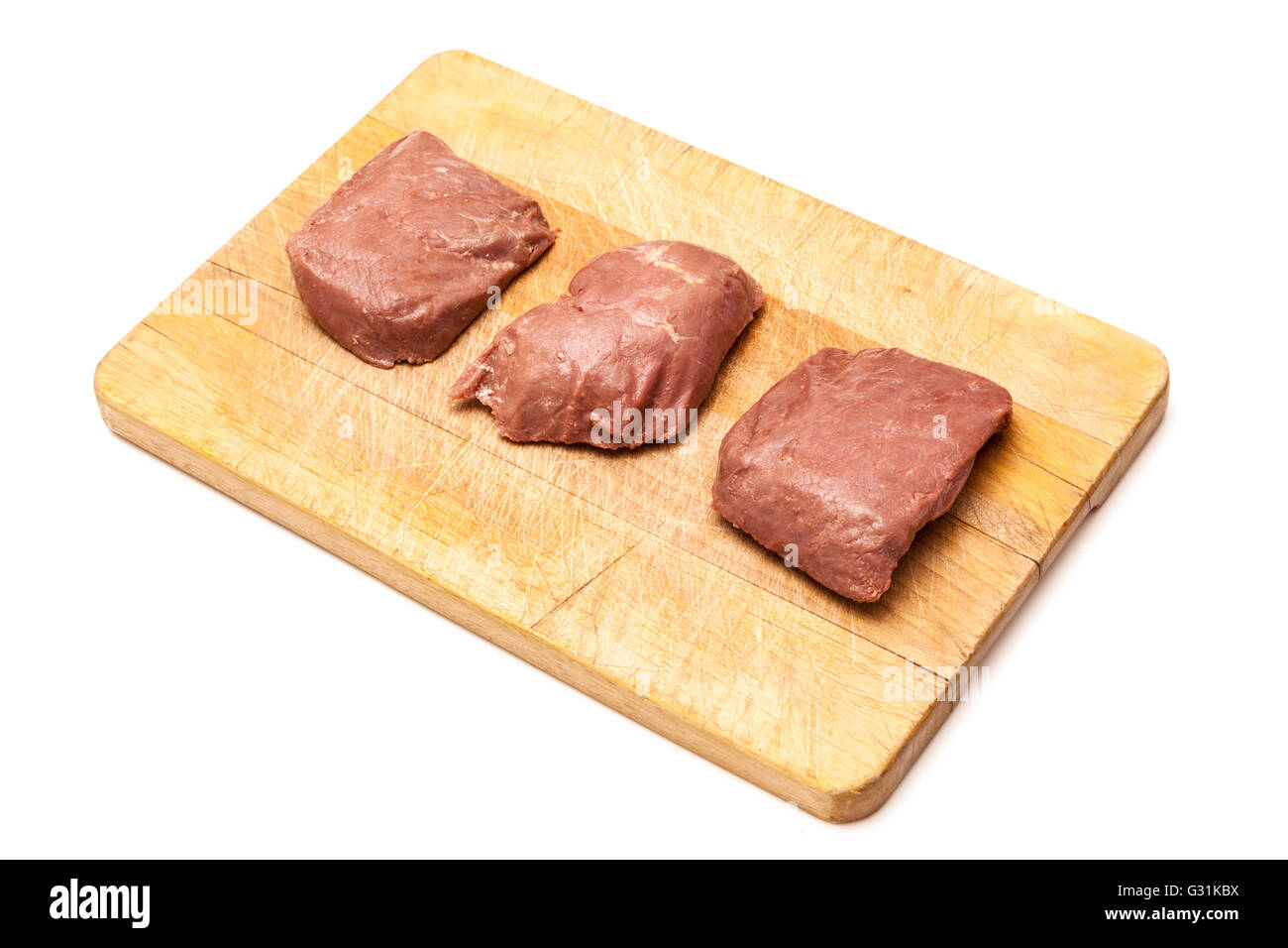 Cooked Ostrich (Struthio camelus) meat steaks isolated on a white ...