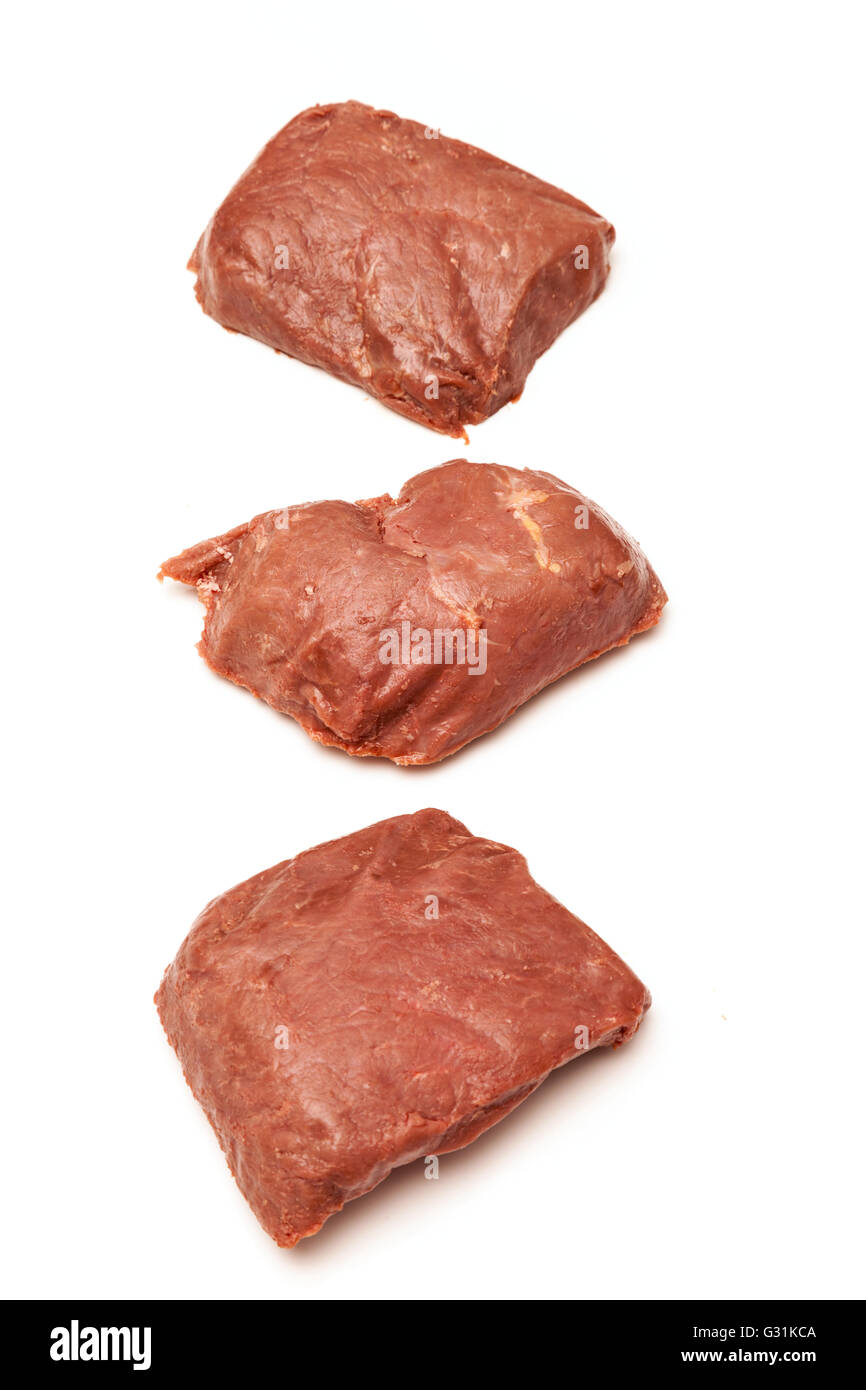 Cooked Ostrich (Struthio camelus) meat steaks isolated on a white ...