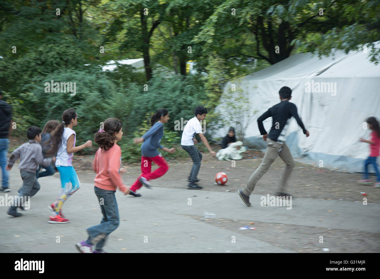 Berlin, Germany, Children playing football at LaGeSo Stock Photo - Alamy
