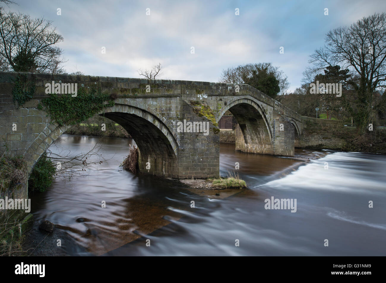 With 2 arches, the historic, stone 'Old Bridge,' Ilkley, West Yorkshire ...