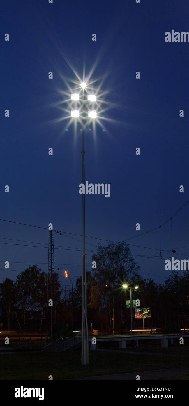 Mast with flood lights. Lighting pylon Stock Photo - Alamy