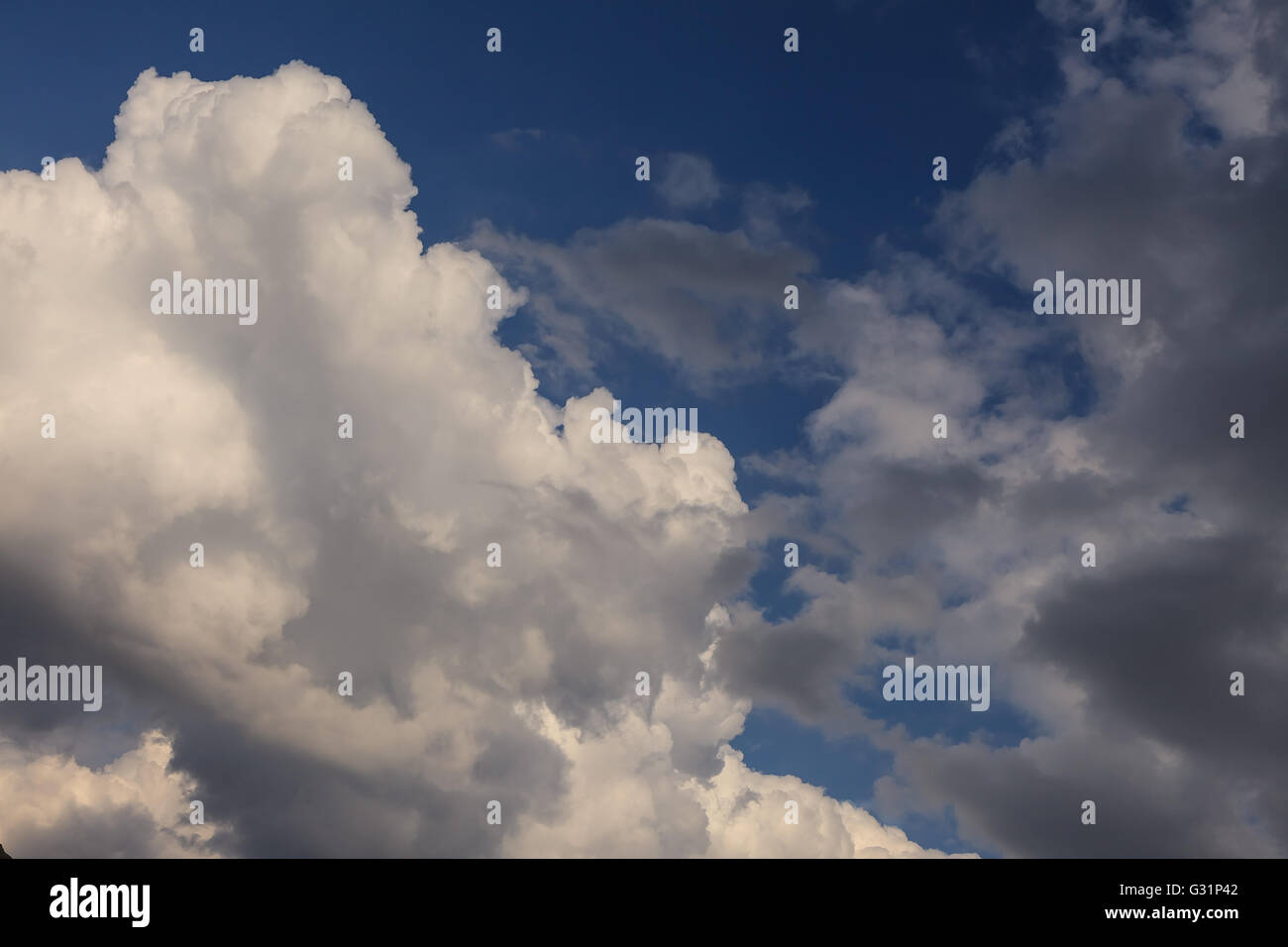 Dramatic stormy dark and light clouds in the blue sky before rain Stock ...