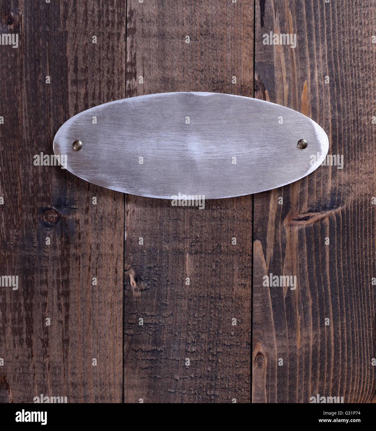 Metal name plate on rustic wooden background Stock Photo - Alamy