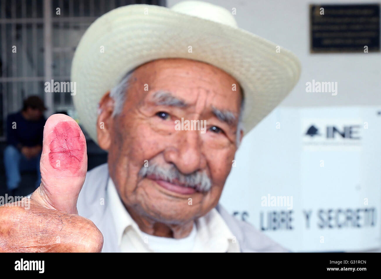 Mexico City, Mexico. 5th June, 2016. An elector shows his inked thumb ...