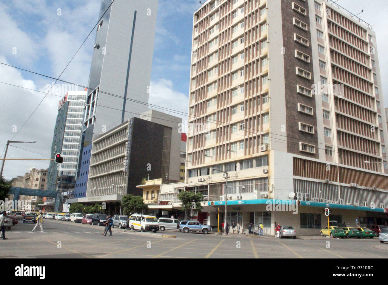 People walk in the center of Mozambique's capital Maputo on May 21 ...