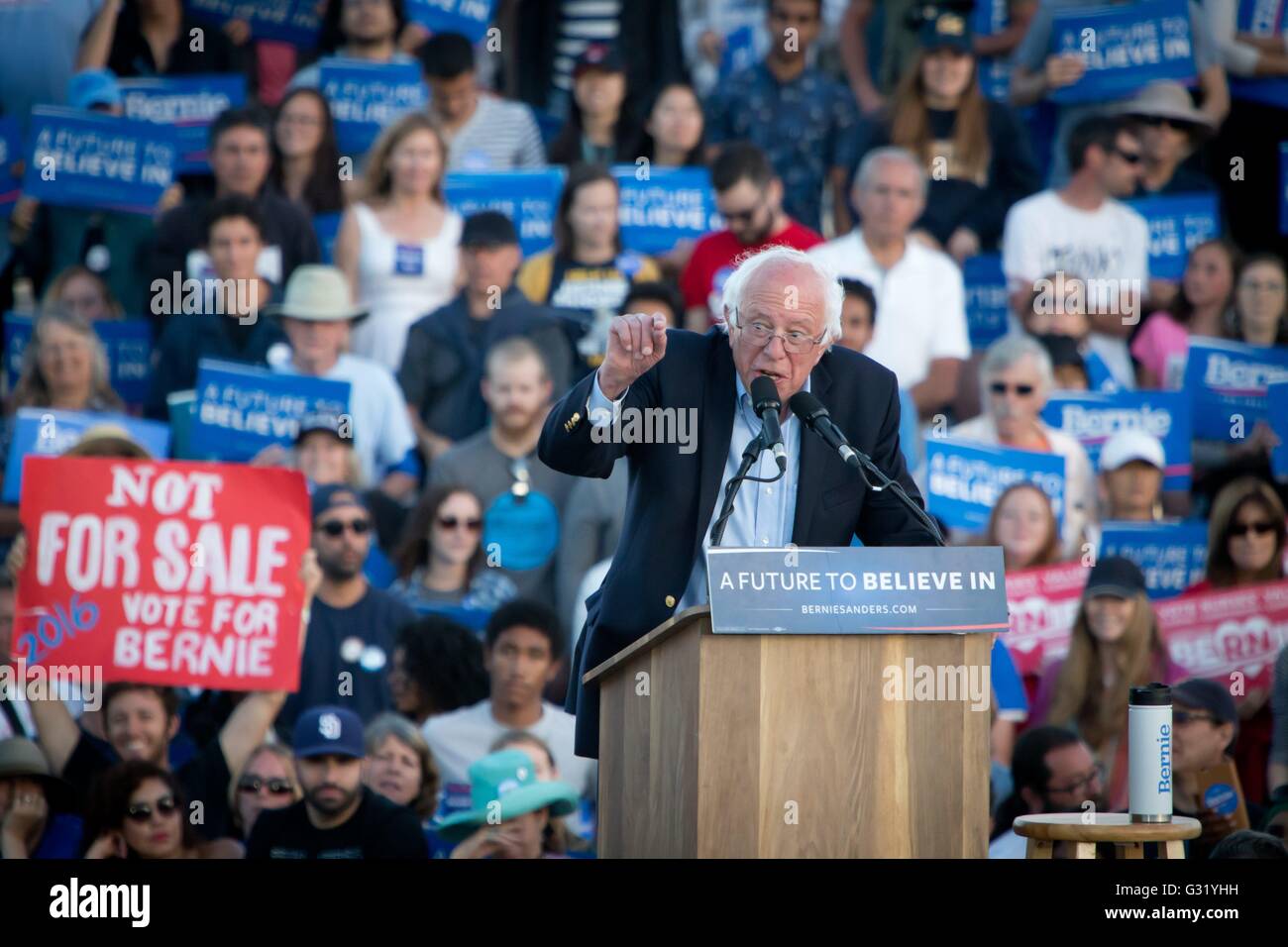 Bernie Sanders holding a speech at a rally in San Diego, surrounded by ...