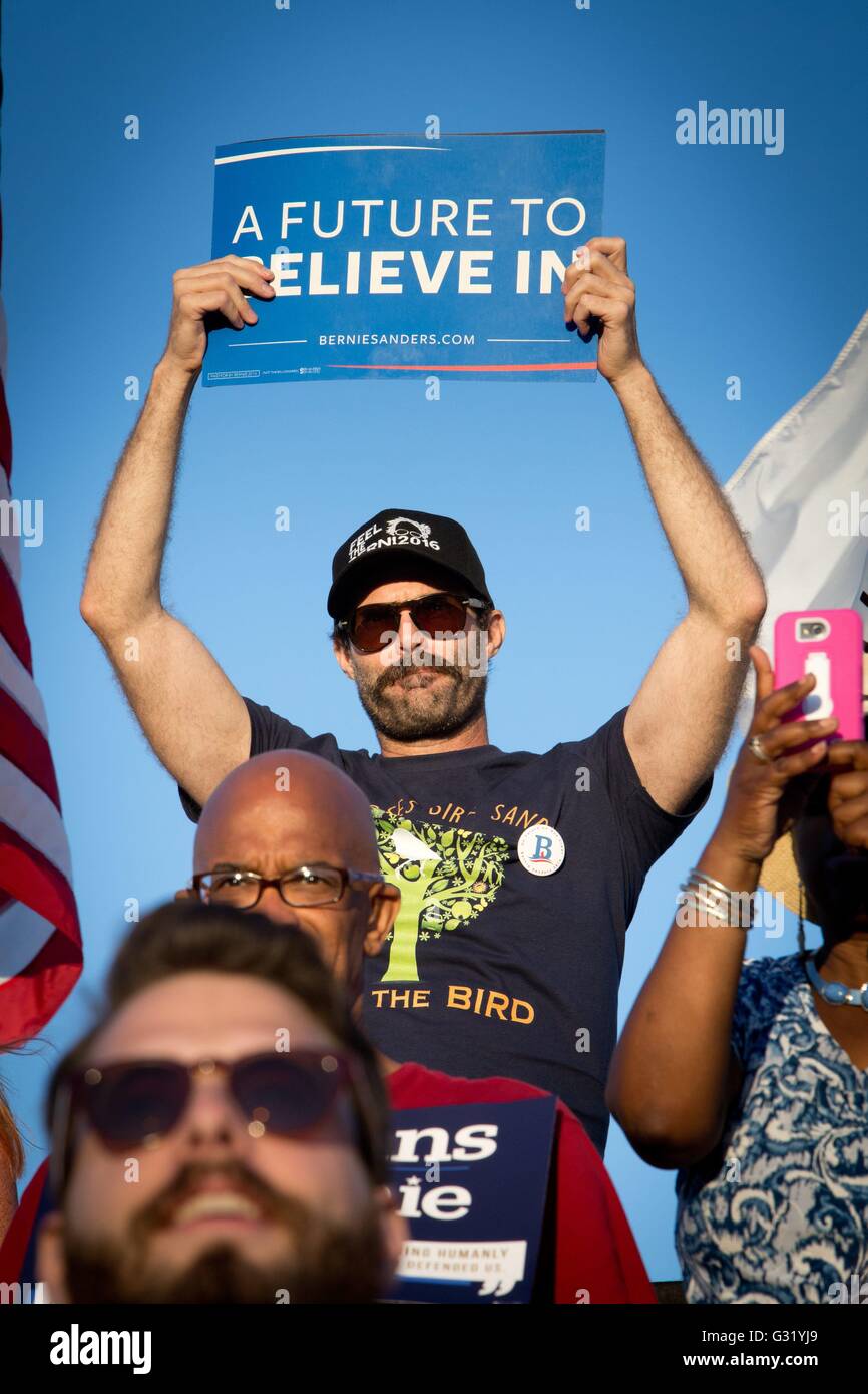 Man holding a Bernie sign at the Bernie Sanders rally in San Diego, in ...