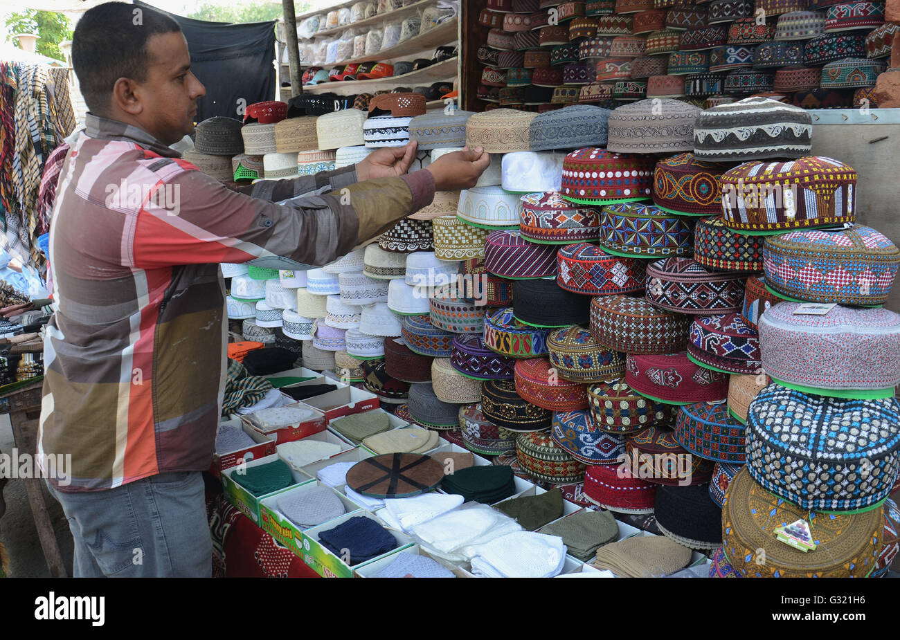 Lahore, Pakistan. 06th June, 2016. Pakistani shopkeeper displaying the ...