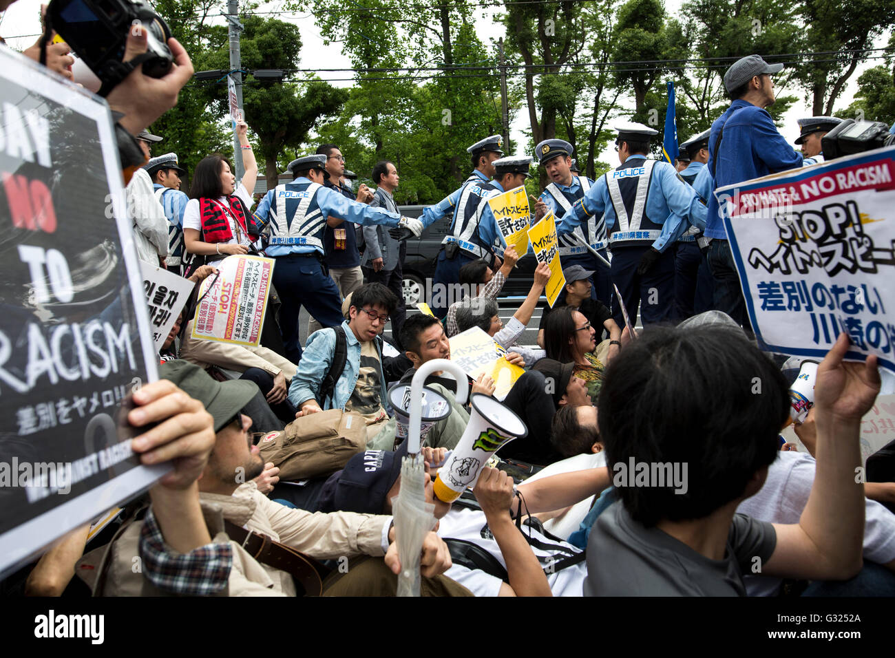 KAWASAKI, JAPAN - JUNE 05: Anti-fascist and anti-racist groups lying ...