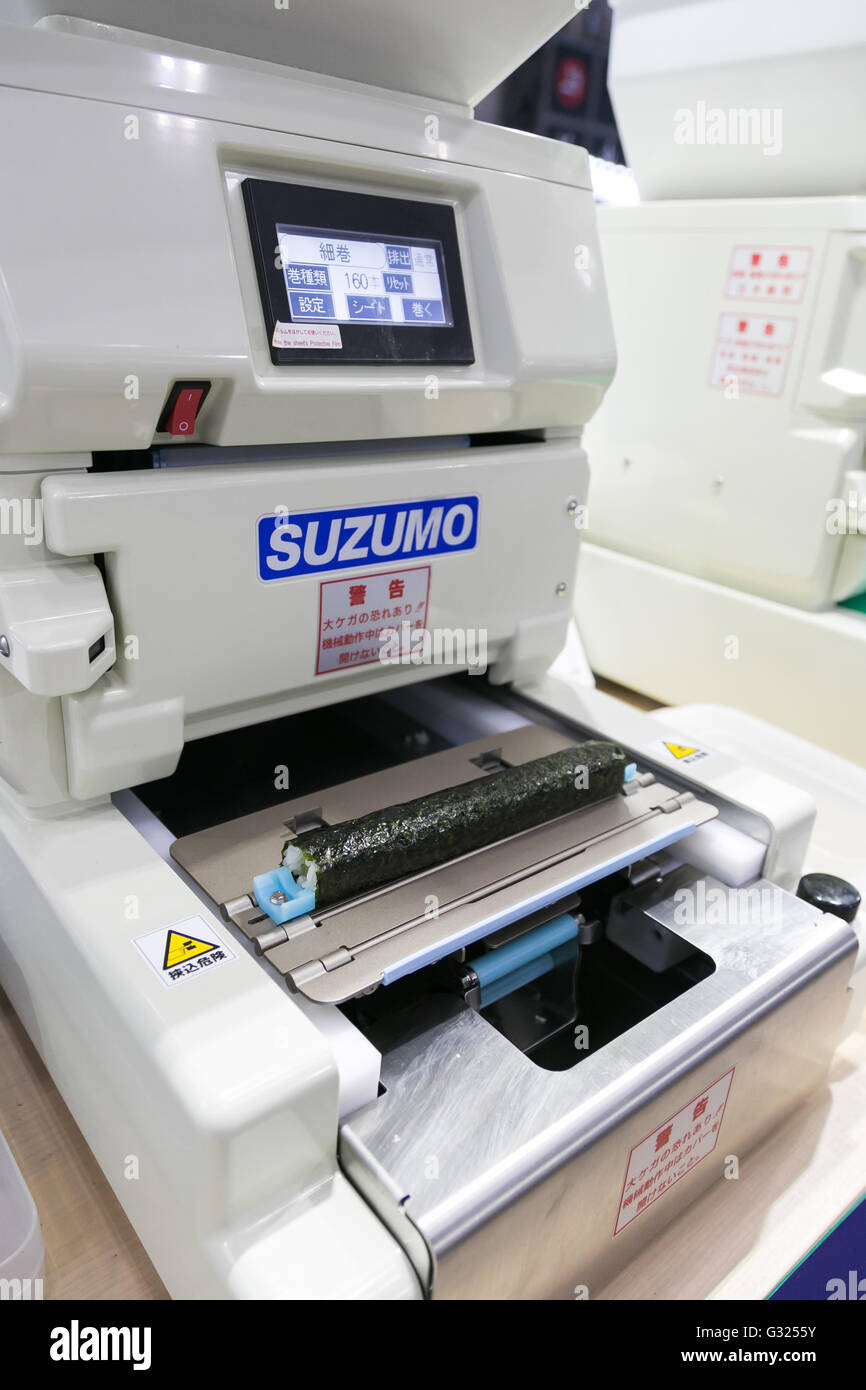 A sushi machine maker on display at the International Food Machinery ...