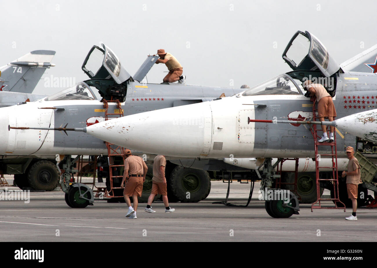 Soldiers prepare heavy bombers of the type Suchoi Su-24 for operation ...