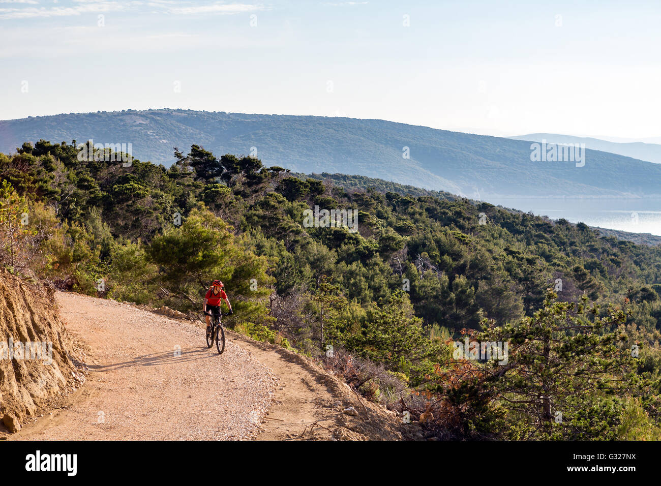 Mountain biker riding on bike in autumn inspirational mountains ...