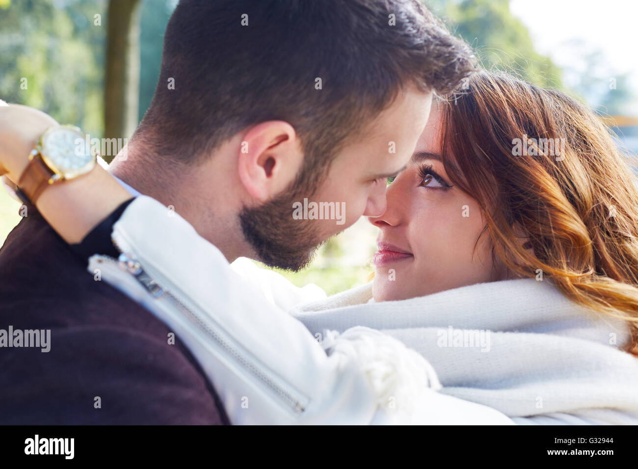 Young people kissing outdoors Stock Photo - Alamy