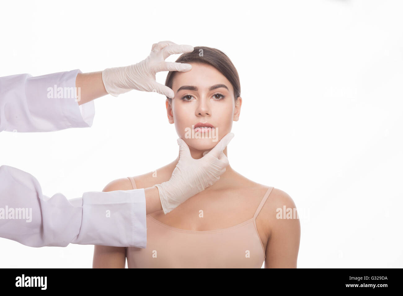 Examining face concept Stock Photo - Alamy