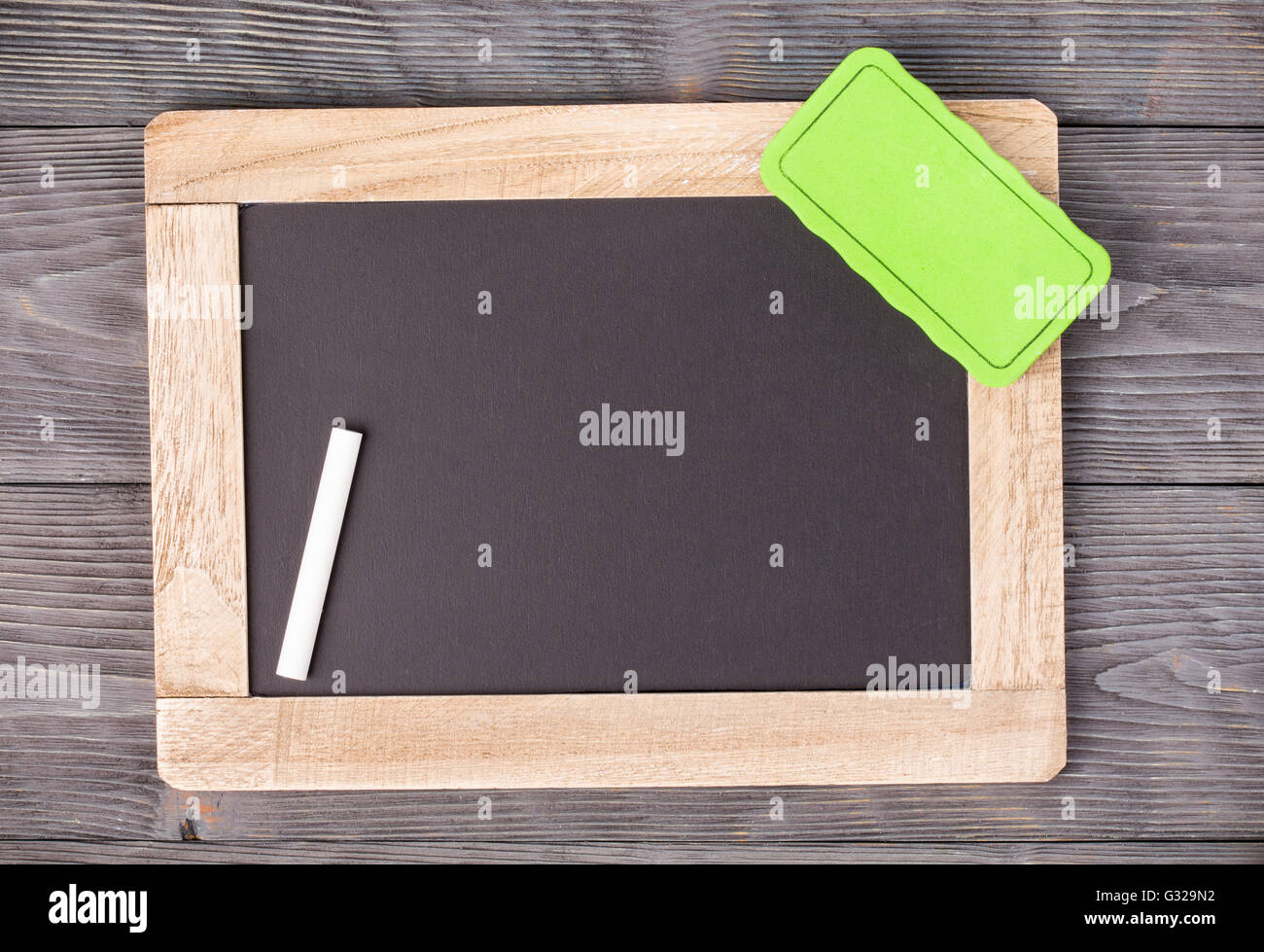 Blackboard green sponge and white chalk with copy space Stock Photo - Alamy