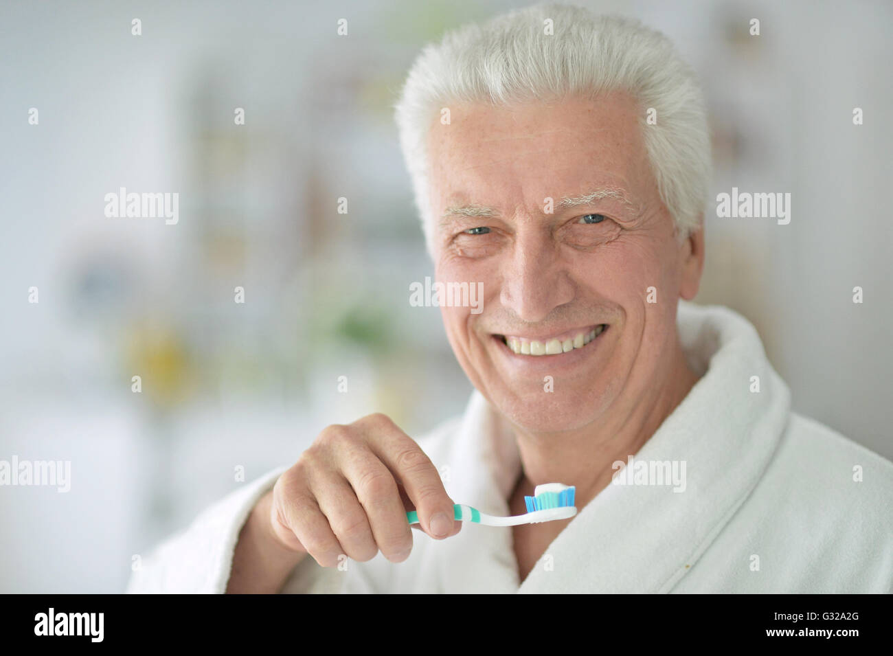 elderly man brushing his teeth Stock Photo - Alamy