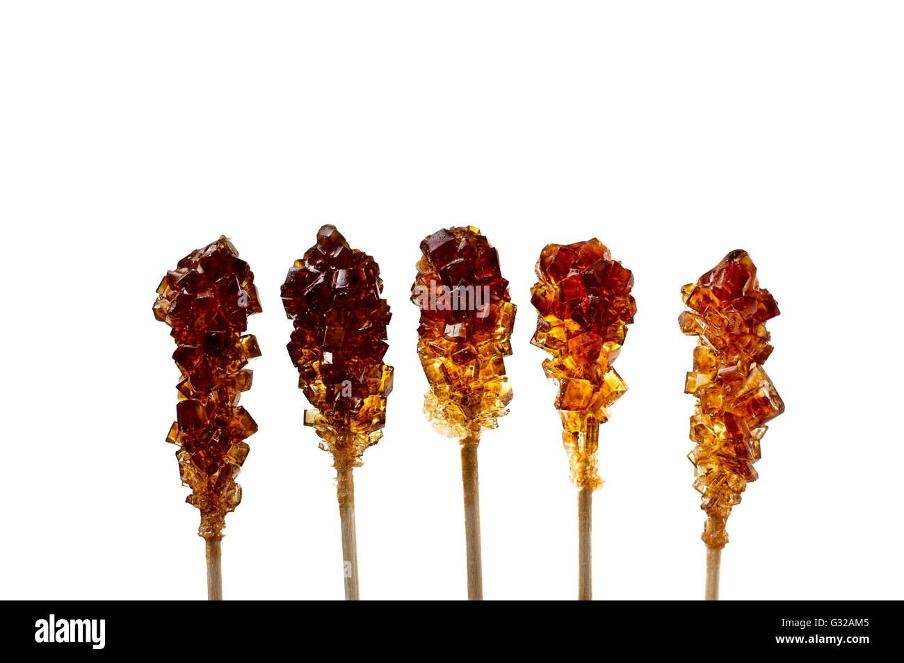 Close up of five brown sugar stirrers isolated on white Stock Photo - Alamy