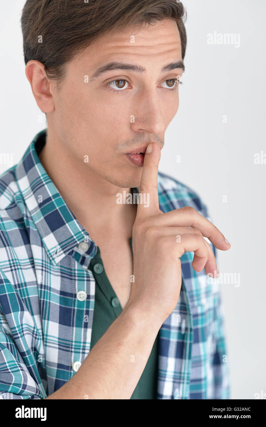 man puts finger on her lips Stock Photo - Alamy