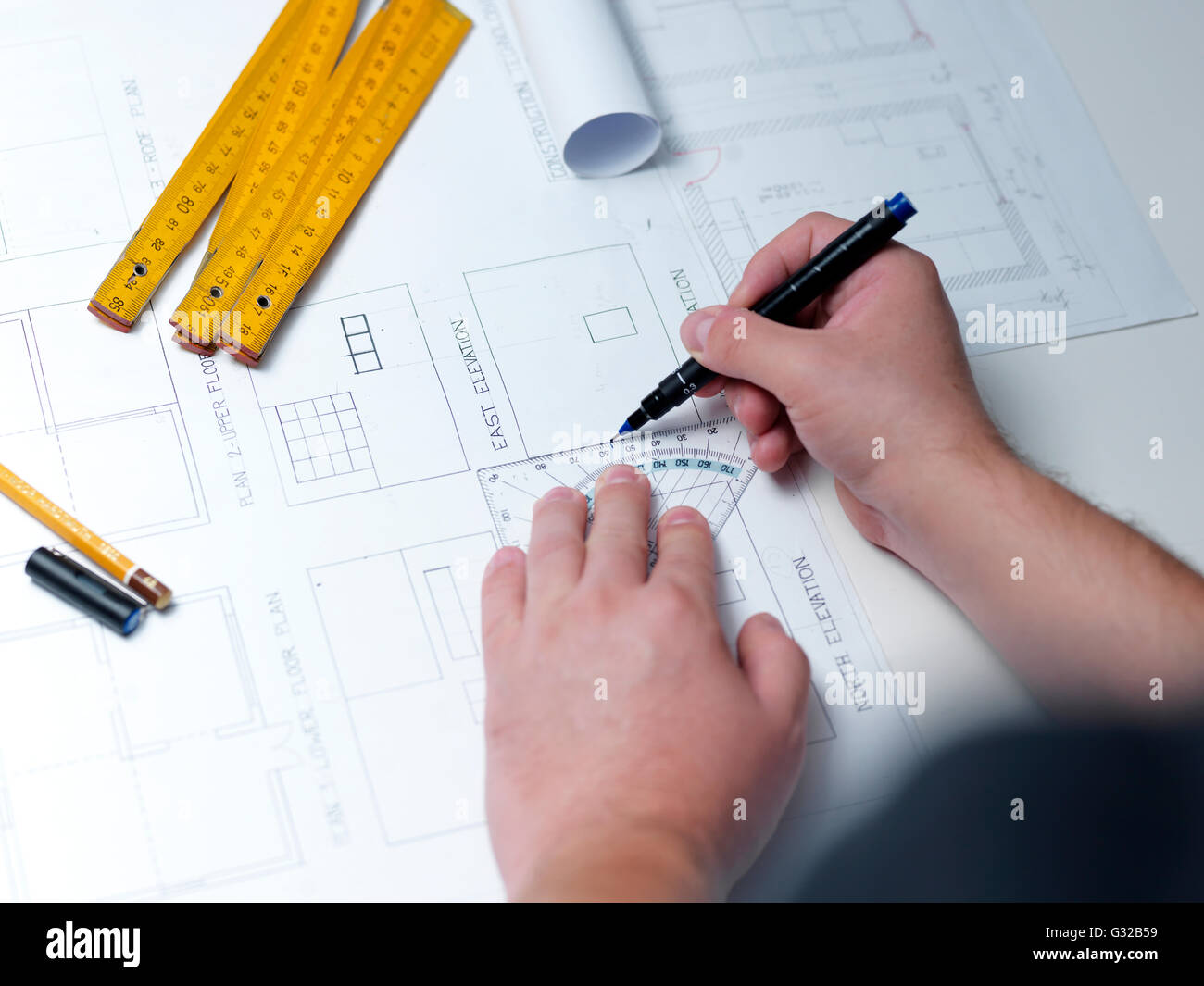 Business man draw buildings and present his architectural project Stock ...