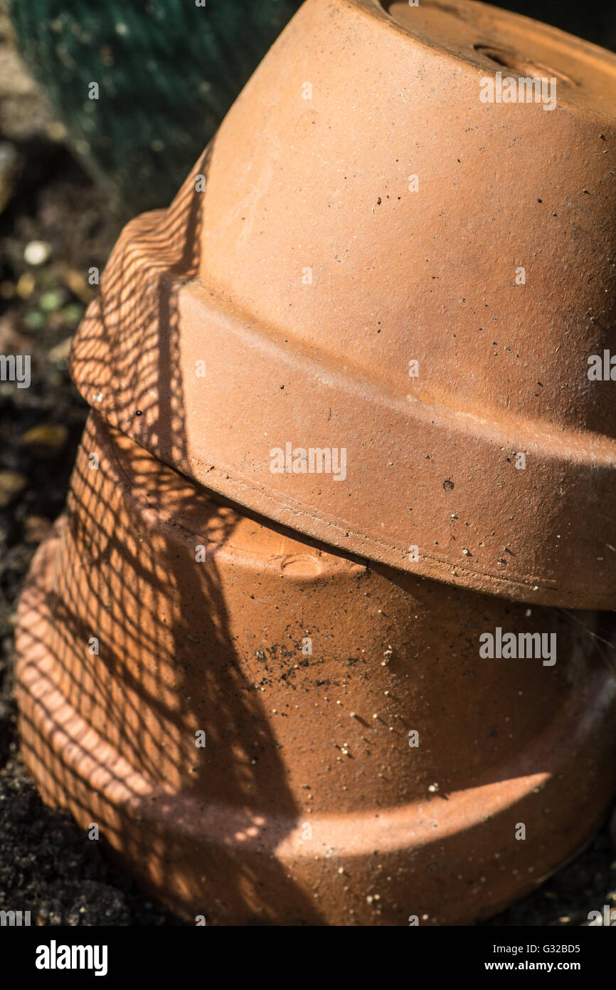 Stack of Terracotta Pots with Shadow Stock Photo - Alamy