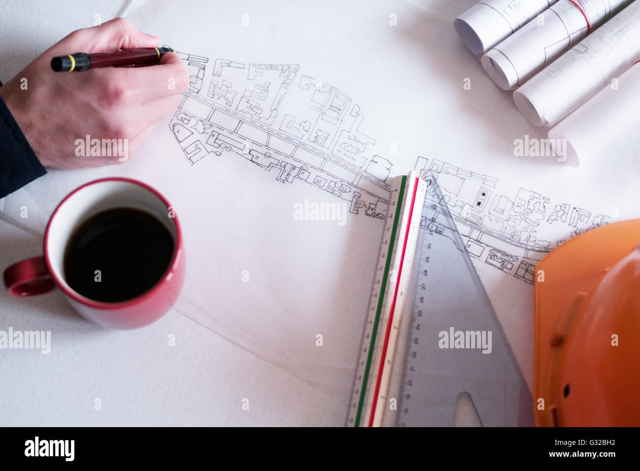 Close-up of three hands with ruler and pencils on a draft Stock Photo ...