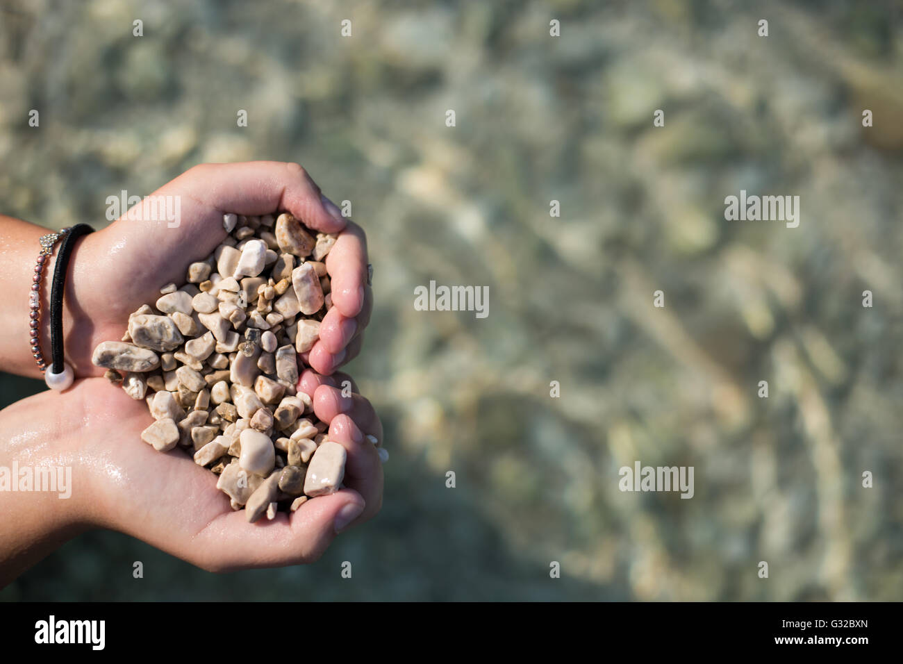 sand in hands in heart shape Stock Photo - Alamy