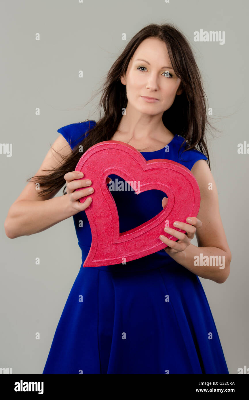 Women holding a heart Stock Photo - Alamy