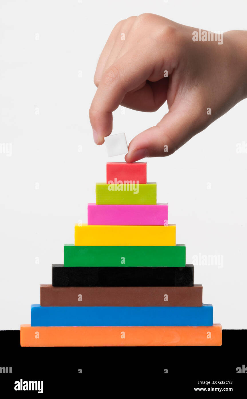 Hand stacking blocks Stock Photo - Alamy